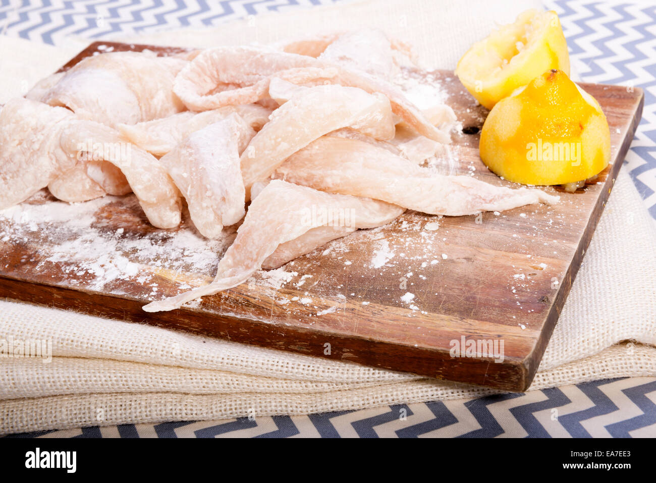 Fresh flathead fish fillets coated in flour ready for cooking with ...