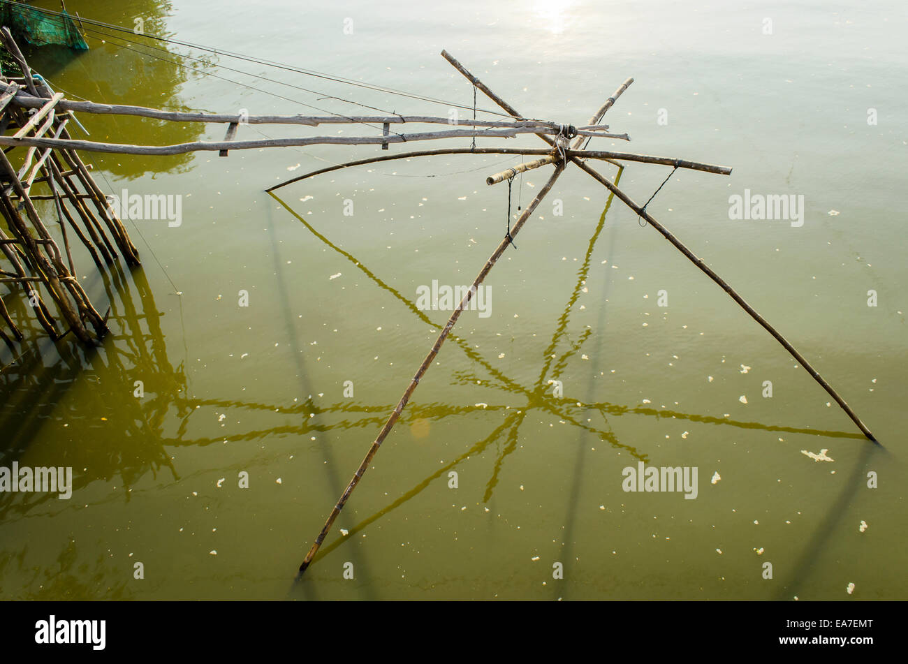 The Square Fish Net in local Canal Stock Photo - Alamy