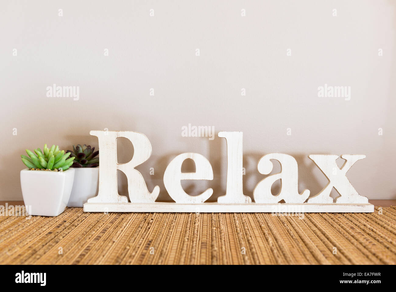 Relax written in large wooden letters with copy space Stock Photo - Alamy