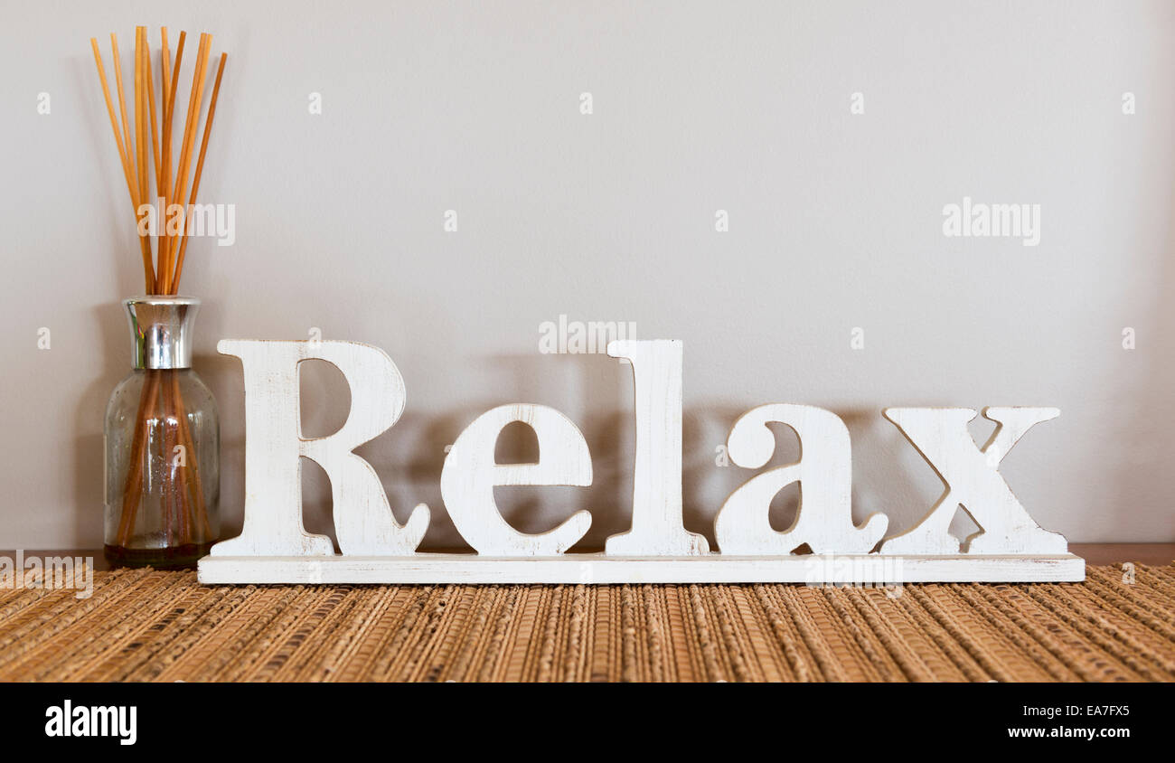 Relax written in large wooden letters with copy space Stock Photo - Alamy