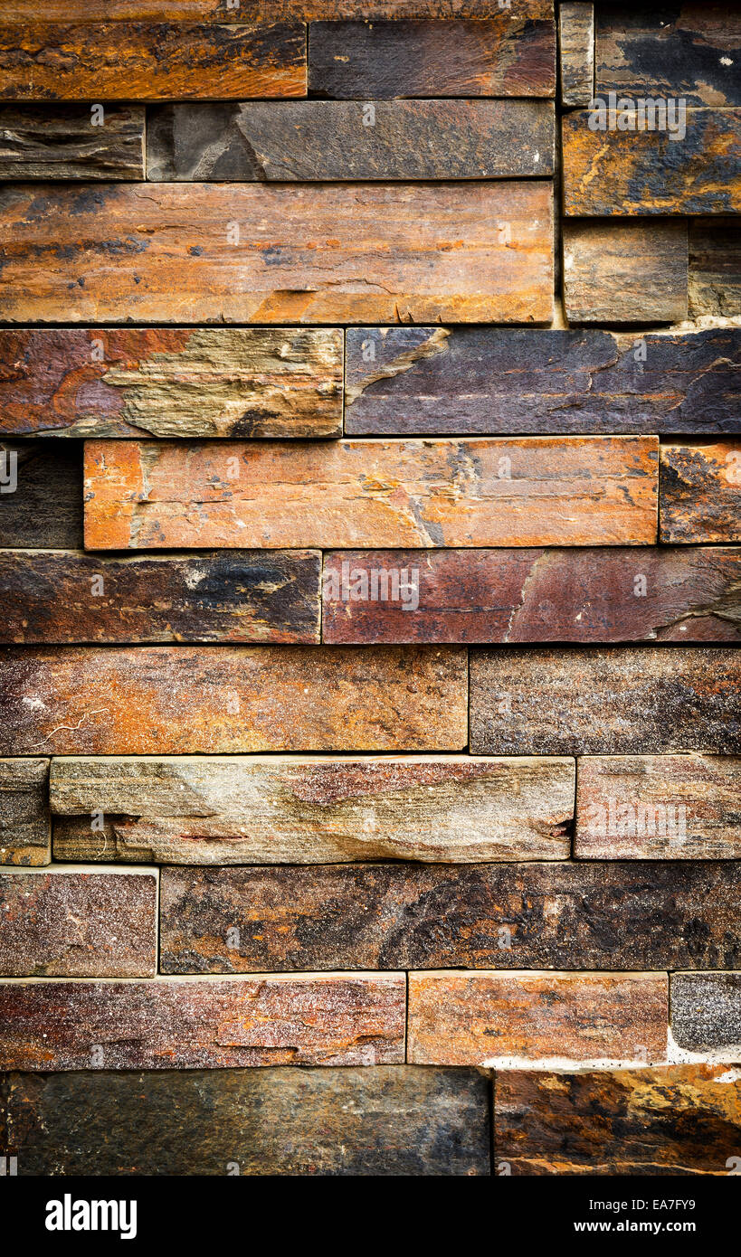 Stacked stone cladding building facade for background texture Stock ...