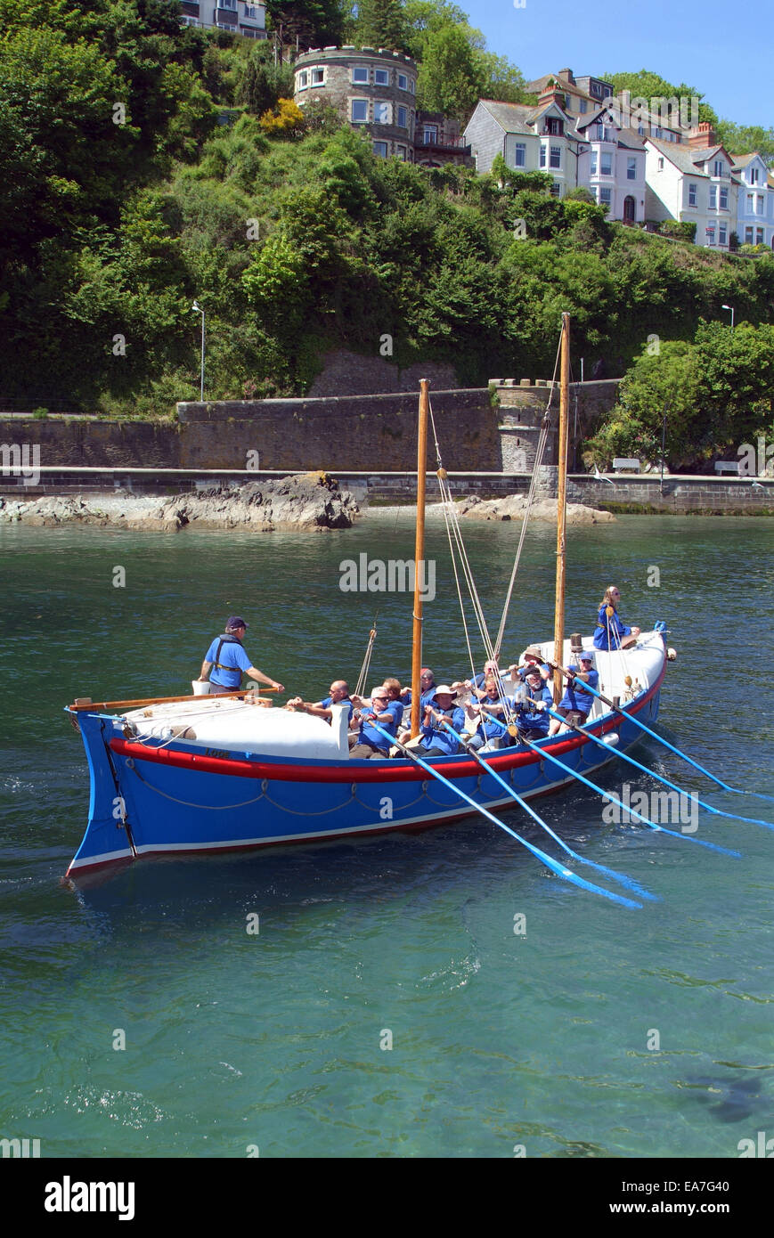 Old Looe lifeboat being rowed up the Looe River into Looe Harbour ...