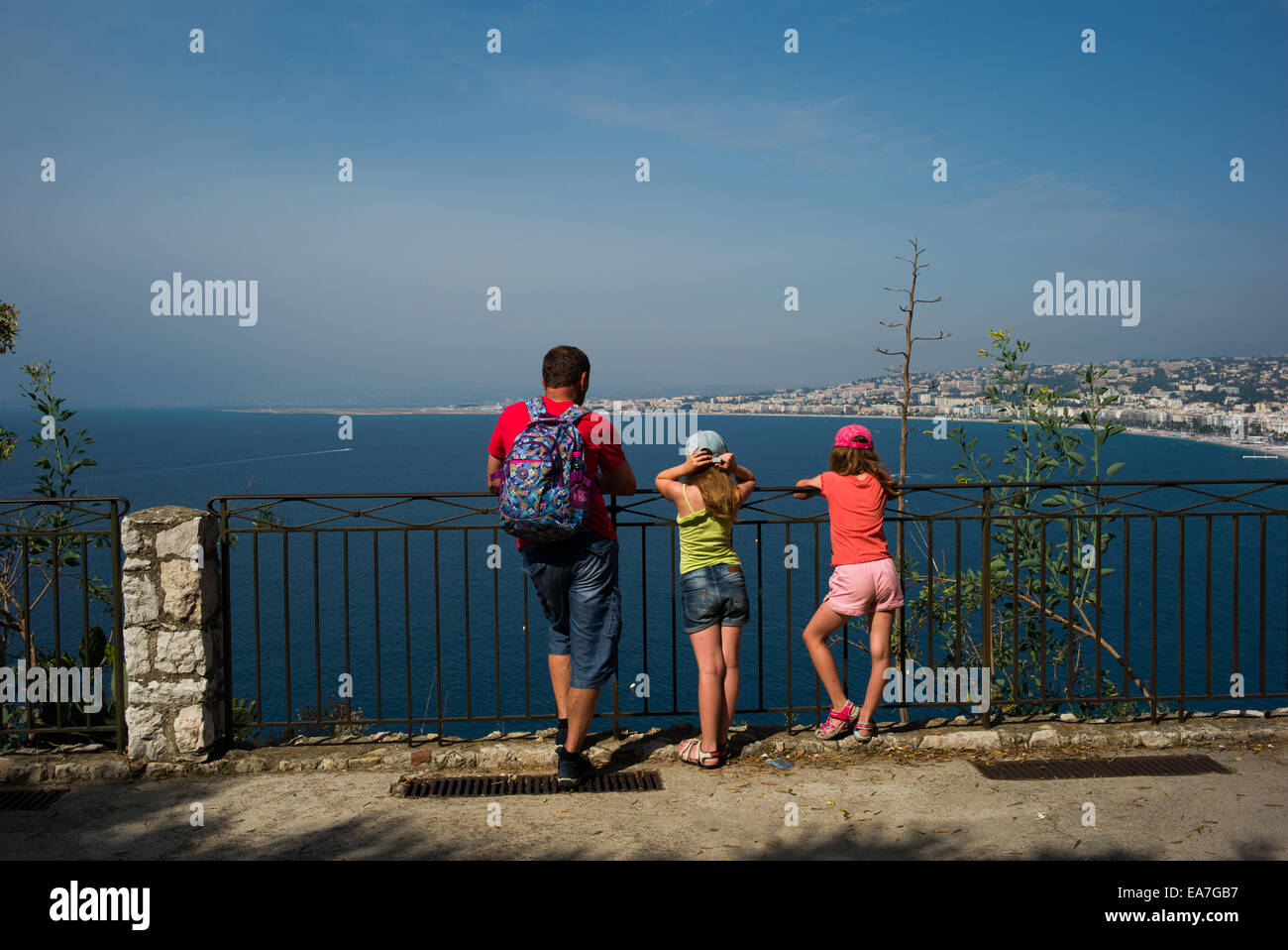 Father and children admiring Nice from the top of the colline du ...