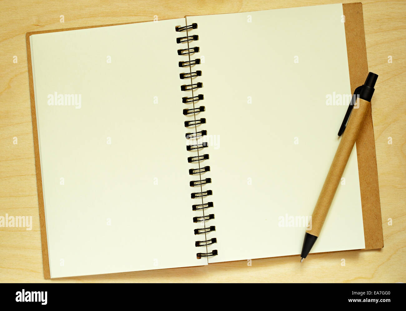 Notebook and a pen on a desk Stock Photo - Alamy