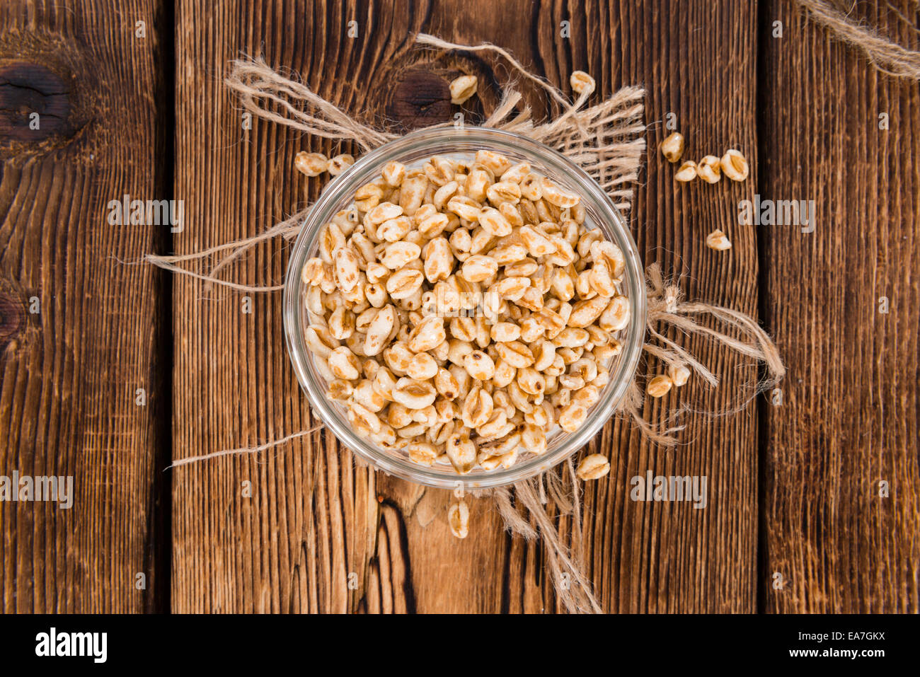 Puffed wheat breakfast cereals with honey and milk Stock Photo - Alamy