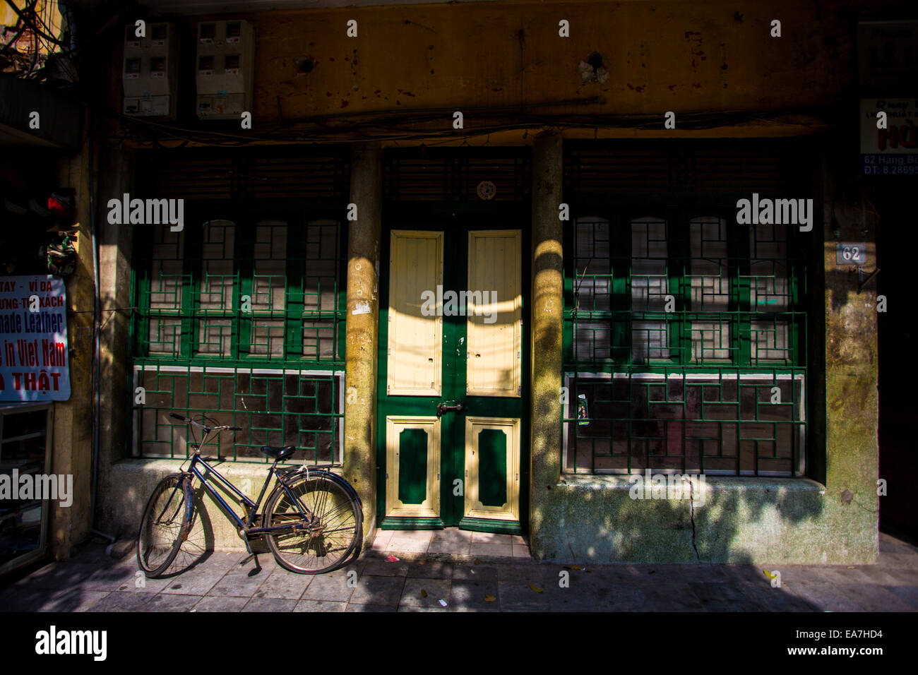Bicycle sits outside store front in Hanoi, Vietnam Stock Photo - Alamy