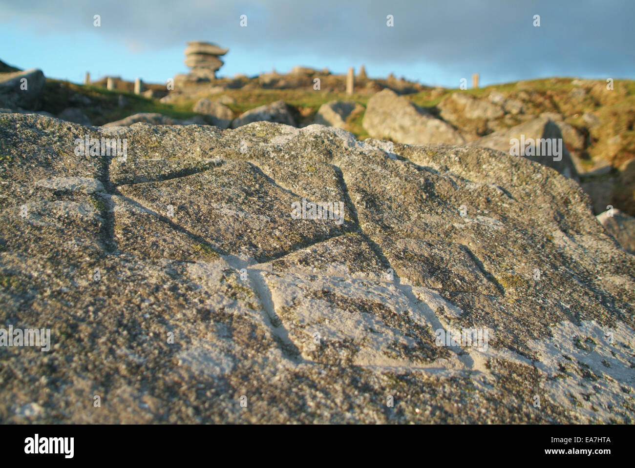 Daniel Gumps geometric carving on granite boulder in front of The ...