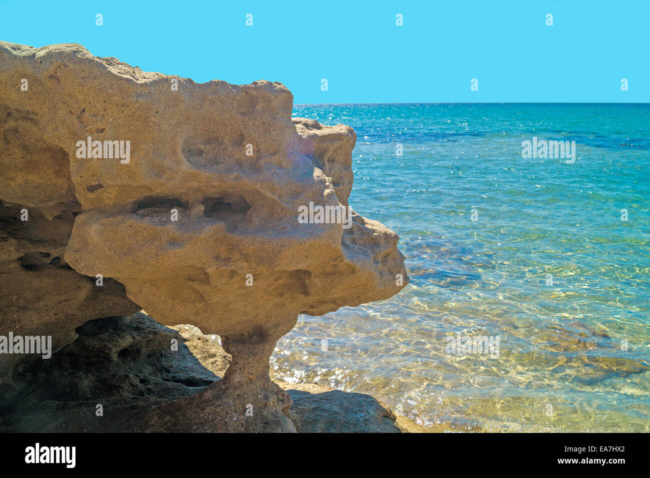 Caves and rock formations by the sea at Sarakiniko area on Milos island ...