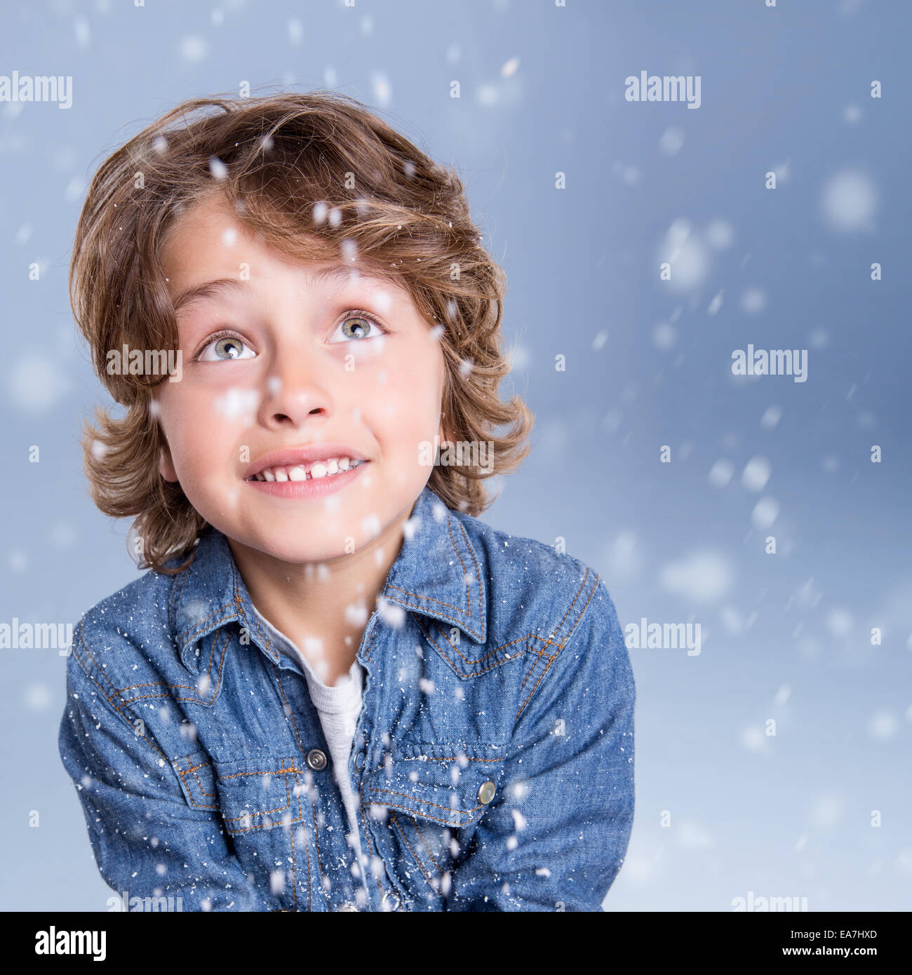 Child looking snow falling with happy face Stock Photo - Alamy