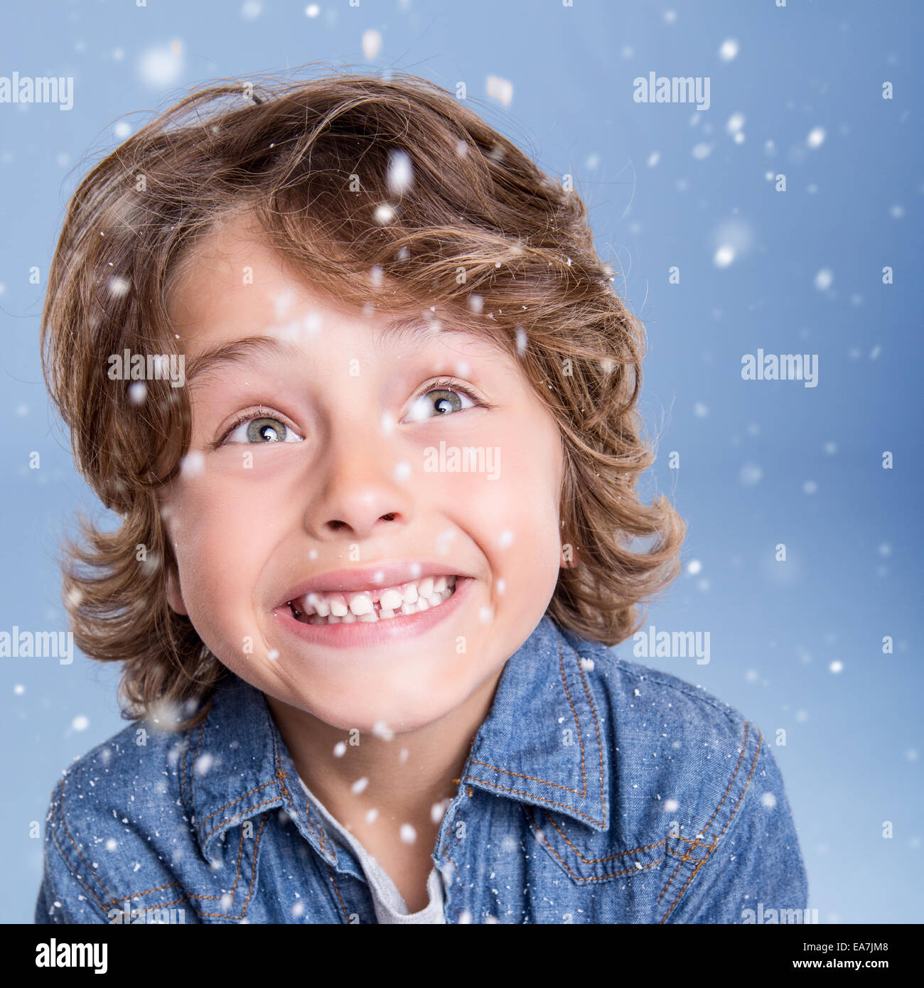 Child looking snow falling with happy face Stock Photo - Alamy