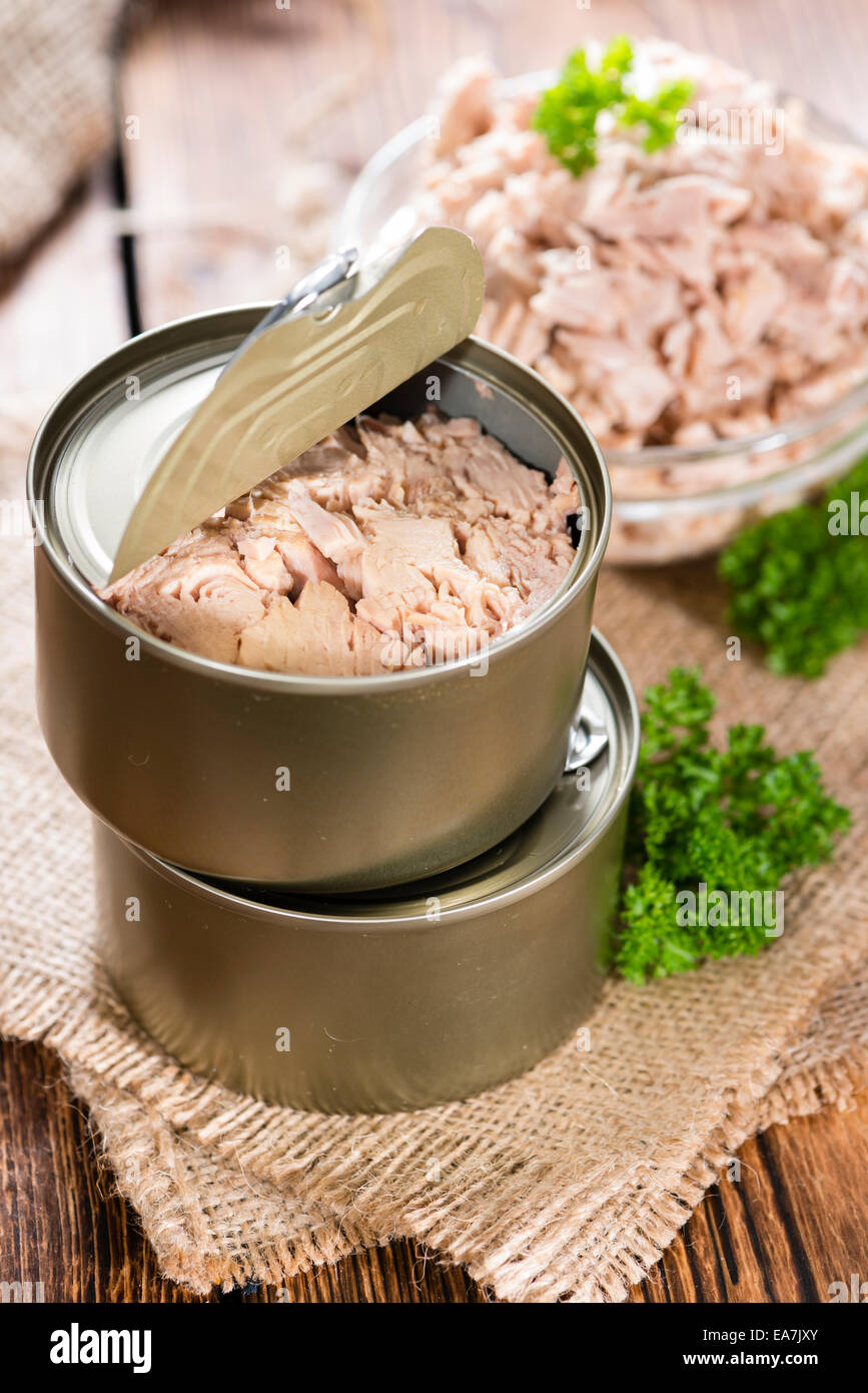 Portion of Tuna with fresh parsly on wooden background Stock Photo - Alamy