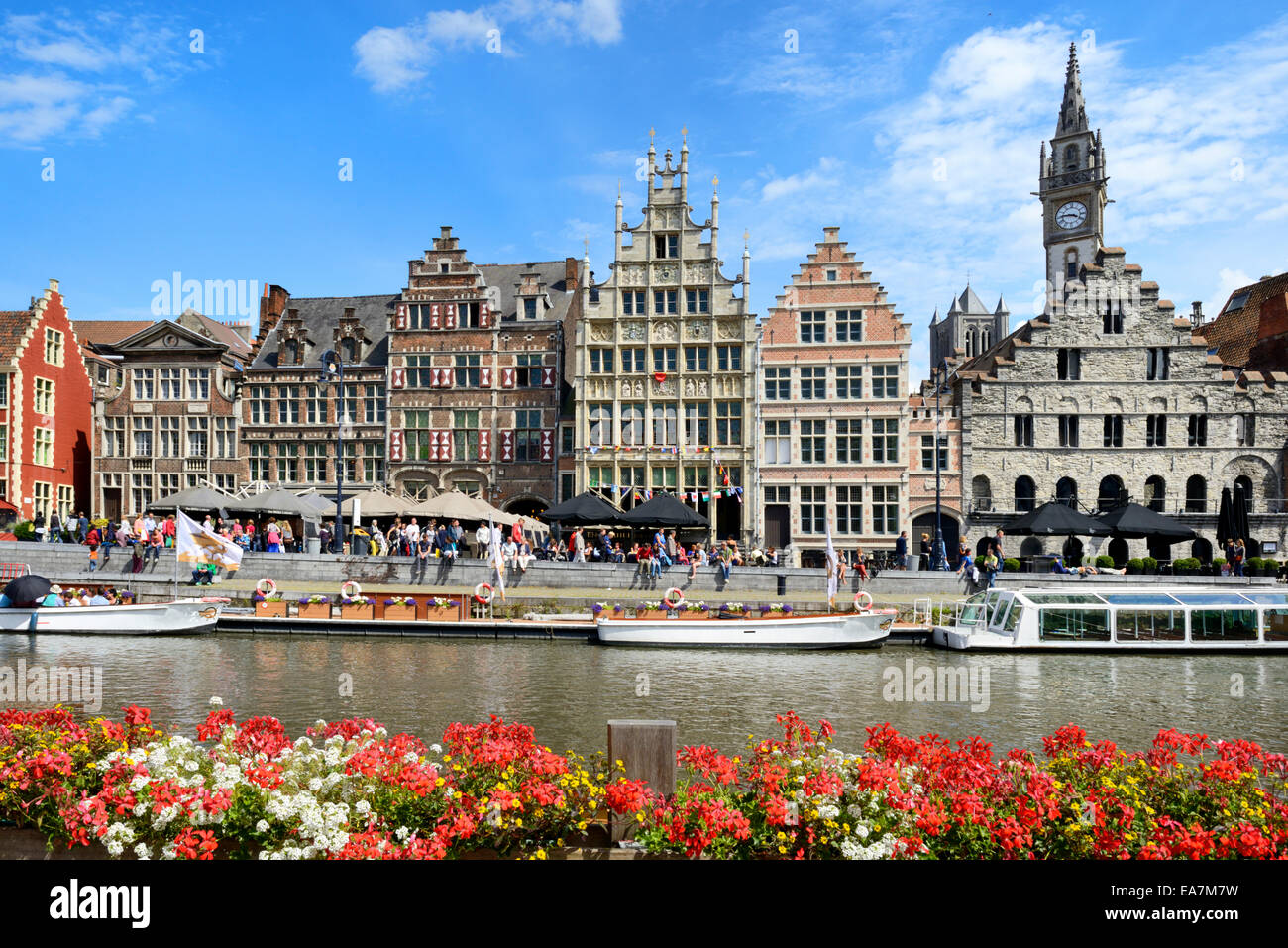 Sightseeing boats on River Leie and medieval guild houses on Graslei ...