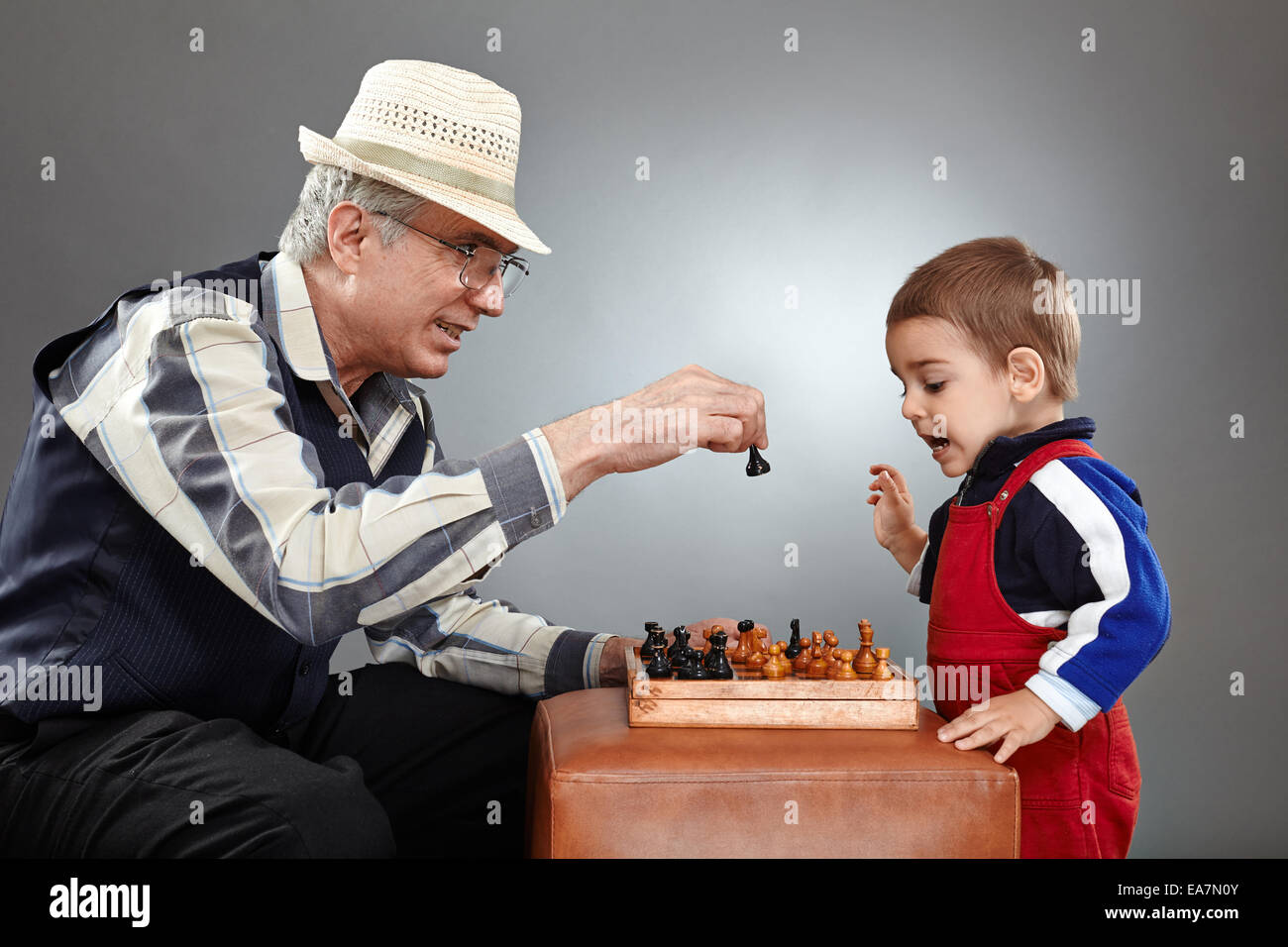 Chess play grandfather grandson hi-res stock photography and images - Alamy