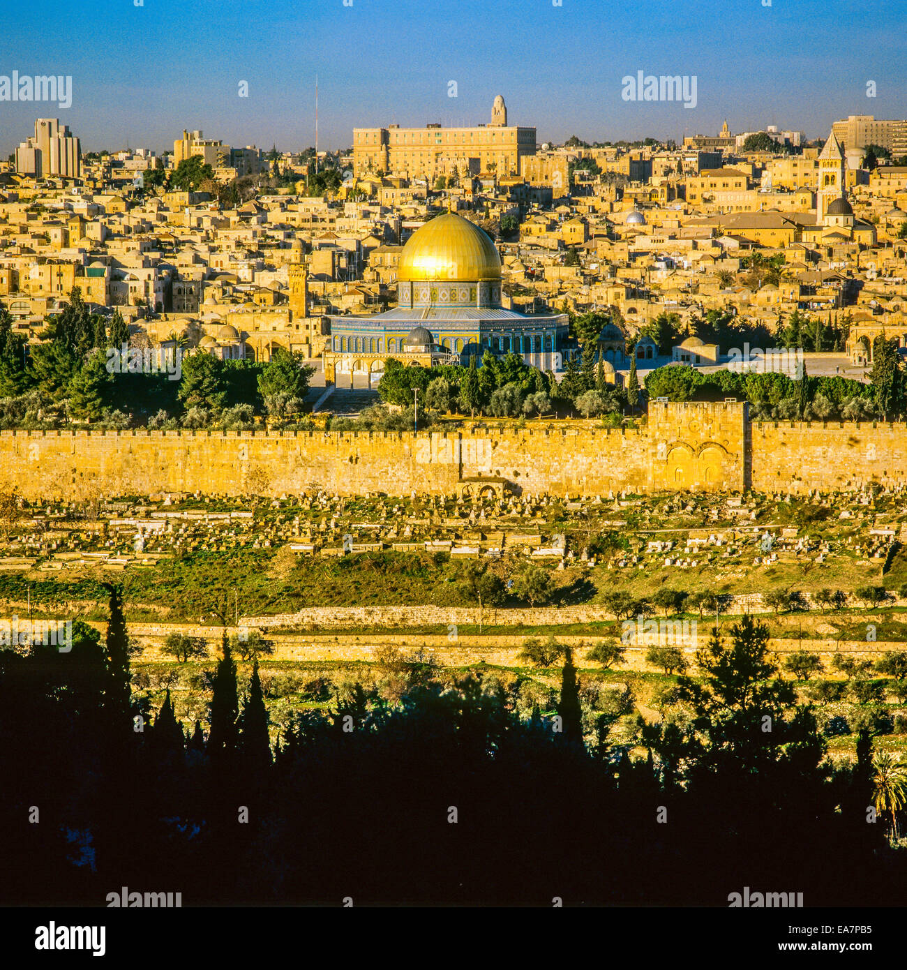Old town skyline with city walls and Dome of the Rock at sunrise ...