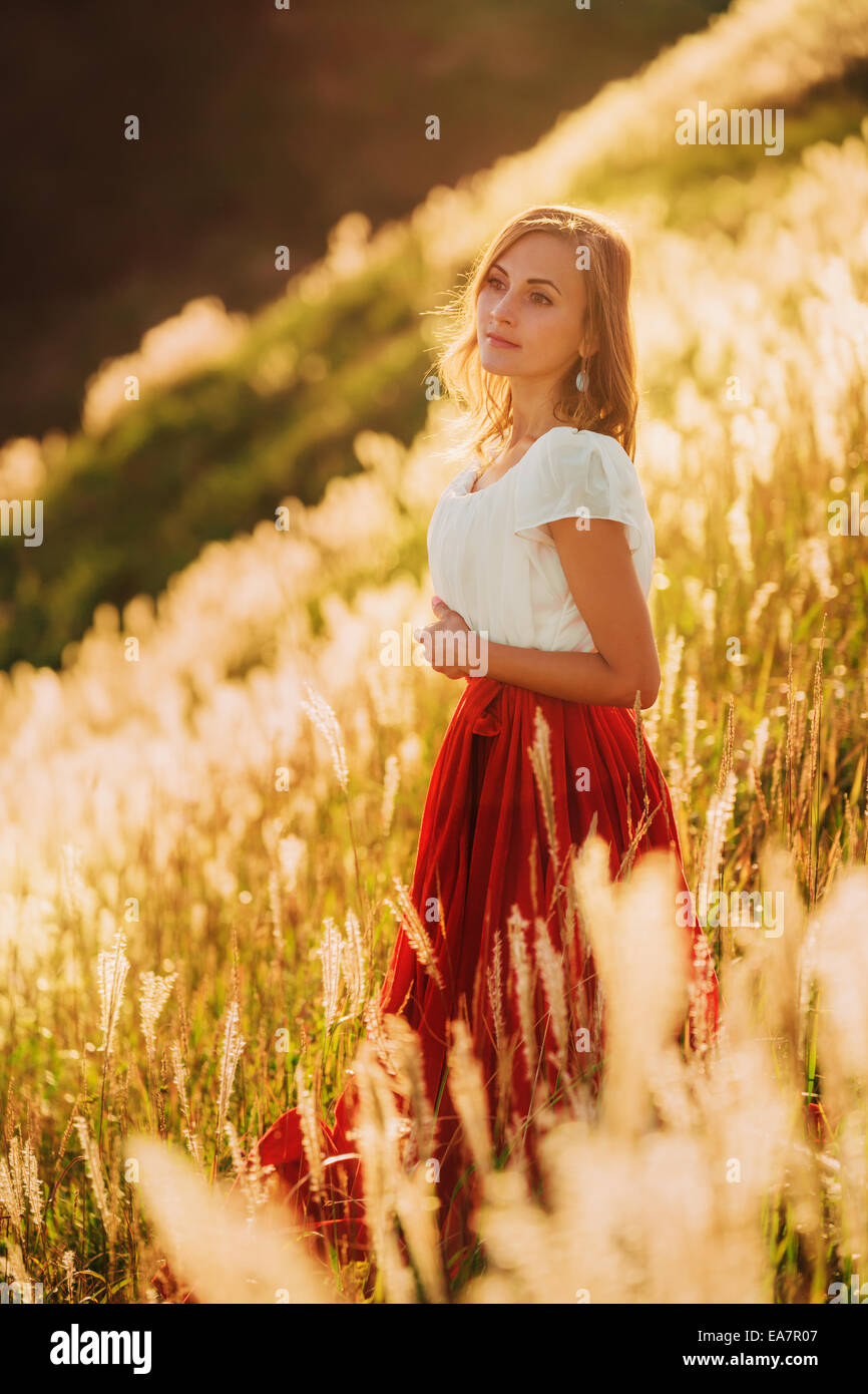 Girl at sunset Stock Photo - Alamy