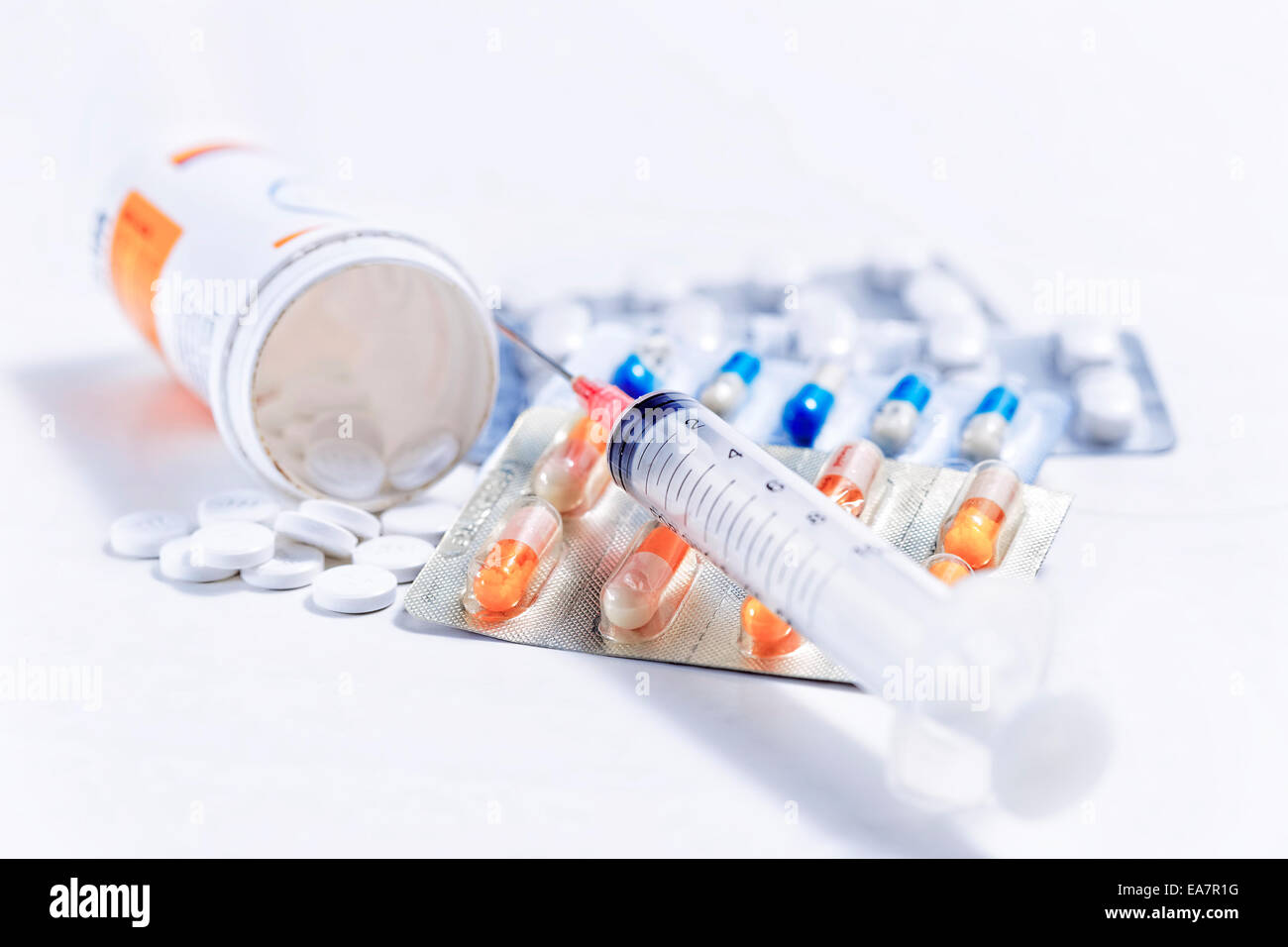 Syringe with glass vials and medications pills drug Stock Photo - Alamy
