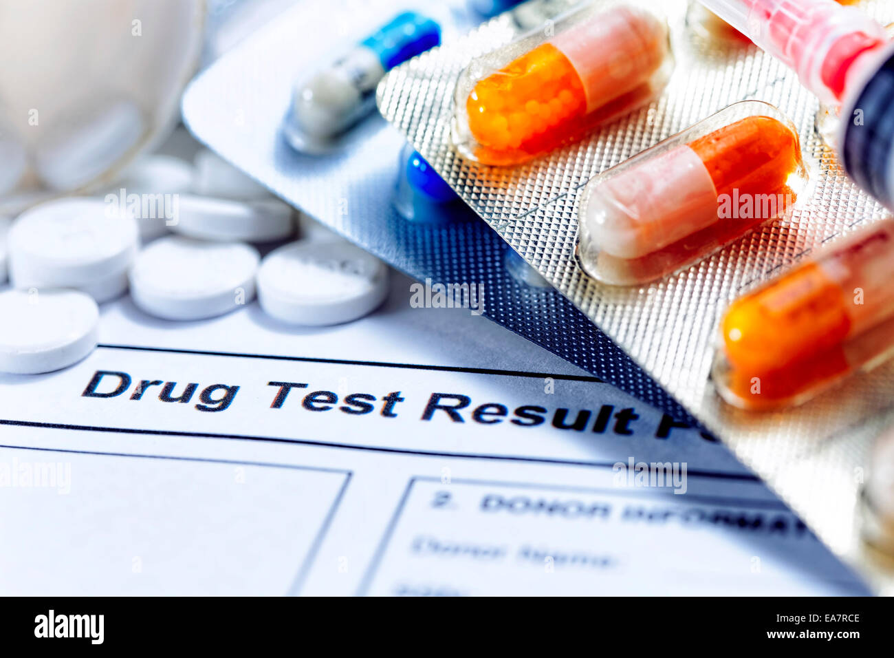 Syringe with glass vials and medications pills drug test report Stock ...