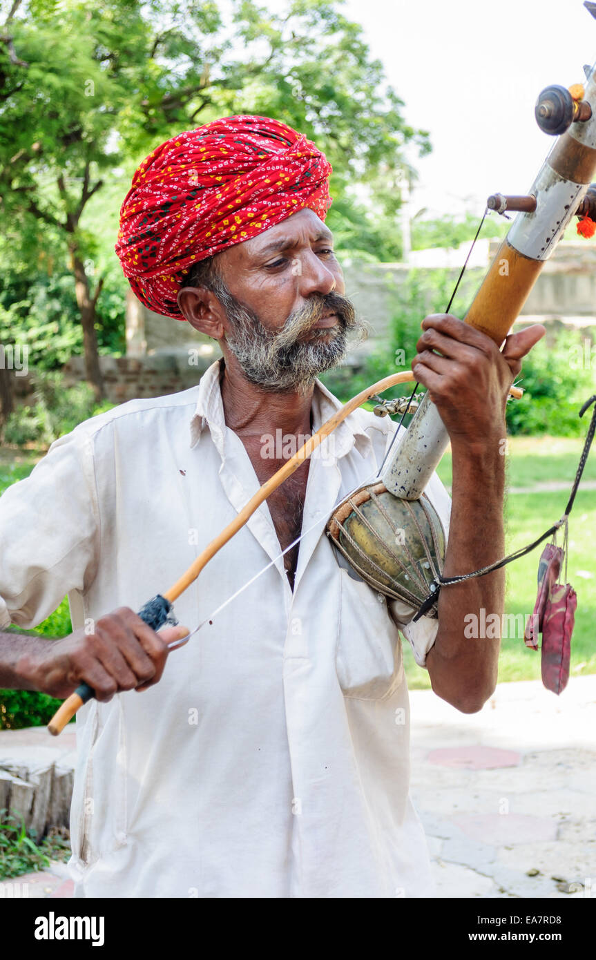 Old folk musician of Rajasthan playing Ravanhatha at Mador garden ...