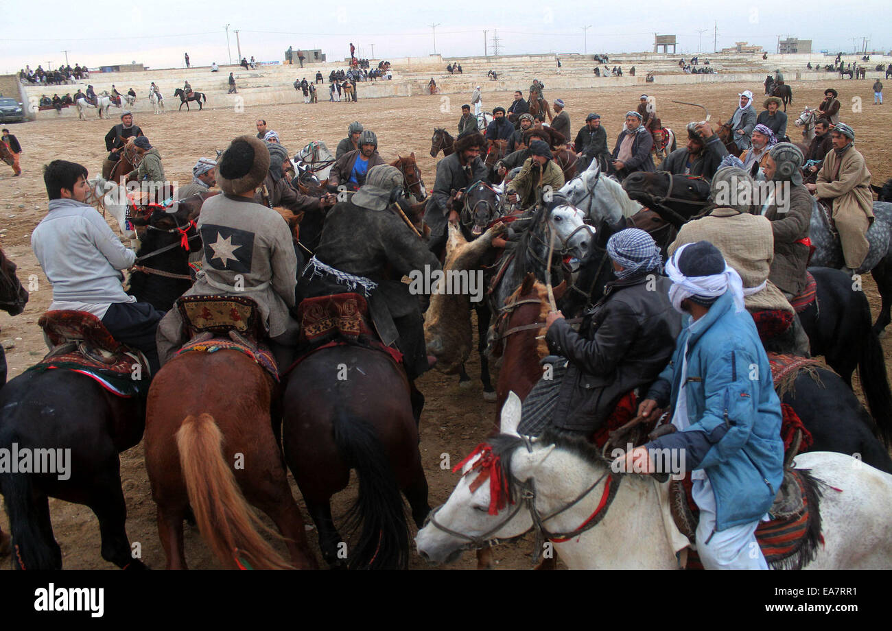 Balkh, Afghanistan. 8th Nov, 2014. Afghan horsemen compete for the goat ...