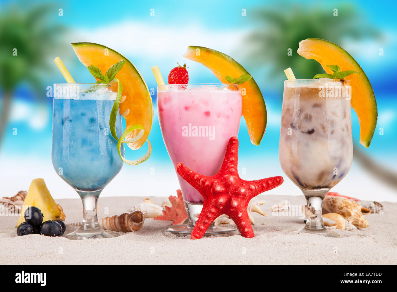 Summer drinks on beach with sea shells Stock Photo - Alamy