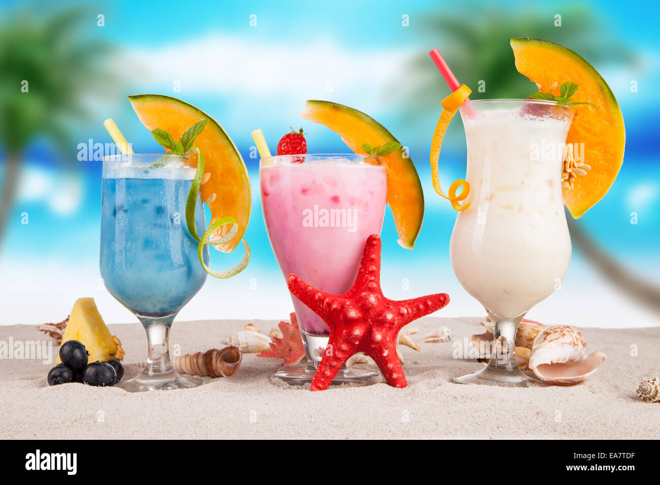 Summer drinks on beach with sea shells Stock Photo - Alamy