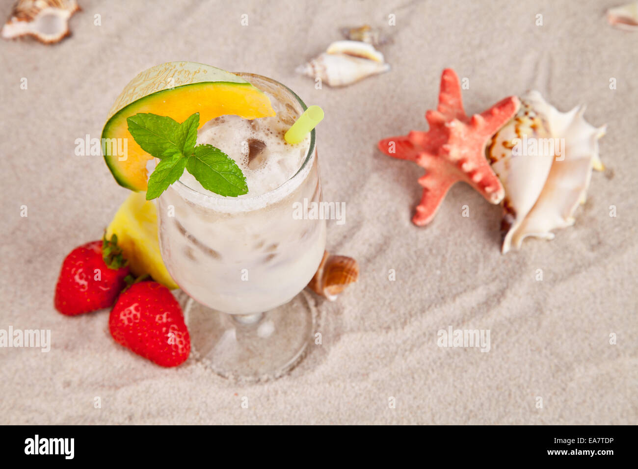 Summer drink on beach with sea shells Stock Photo - Alamy