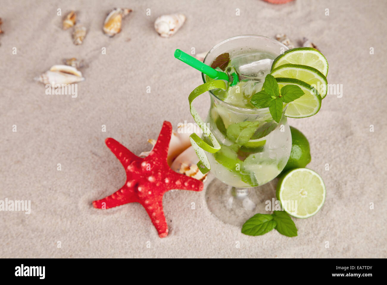 Summer drink on beach with sea shells Stock Photo - Alamy