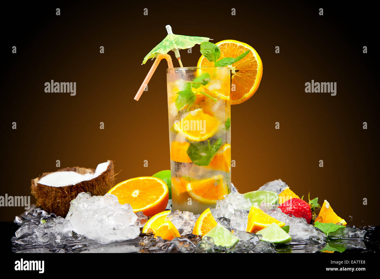 Fruit cocktail with dark background Stock Photo - Alamy