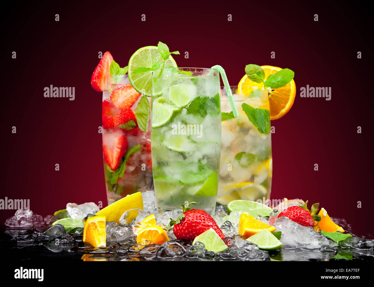 Fruit cocktail with dark background Stock Photo - Alamy