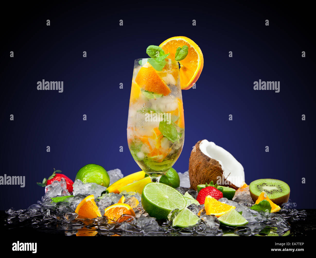 Fruit cocktail with dark background Stock Photo - Alamy