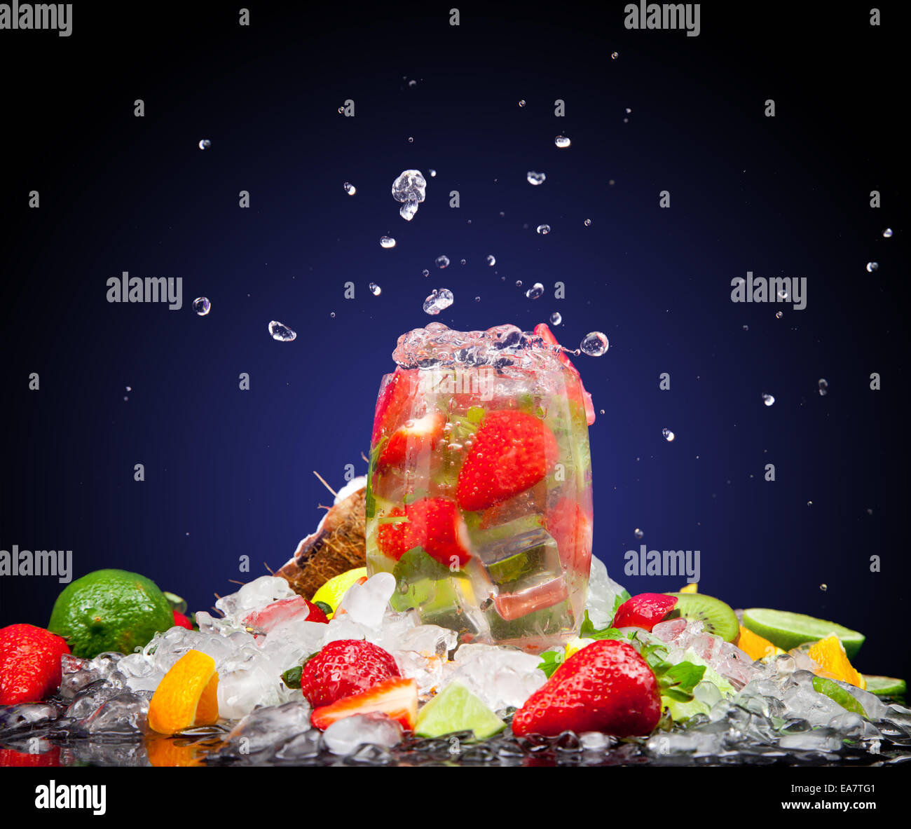 Fruit cocktail with dark background Stock Photo - Alamy