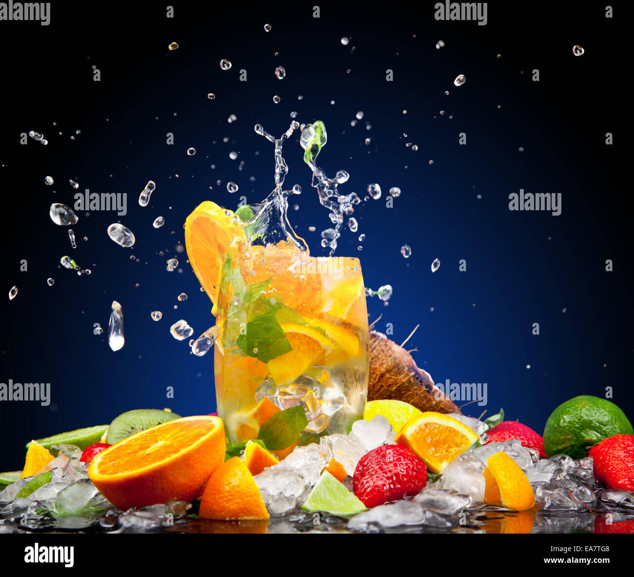 Fruit cocktail with dark background Stock Photo - Alamy