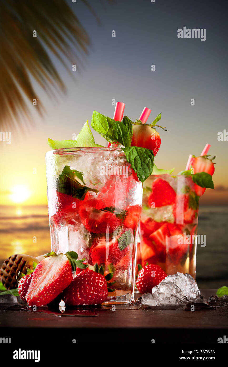 Mojito drinks on stone with evening blur ocean shore background Stock ...