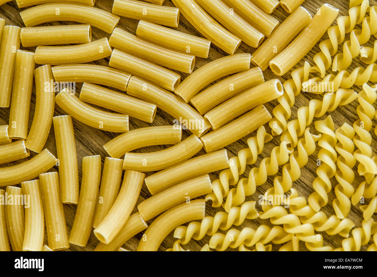 Italian dry pasta covers all over the wooden table Stock Photo - Alamy