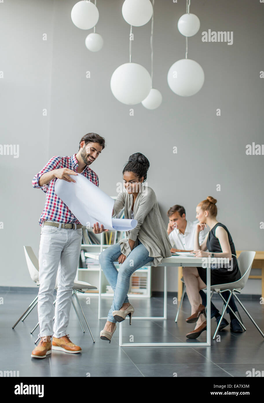 Young people in the office Stock Photo - Alamy