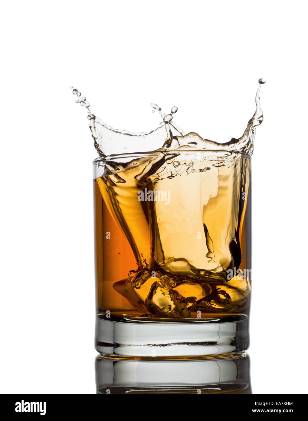 Isolated shots of whiskey with splash on white Stock Photo - Alamy