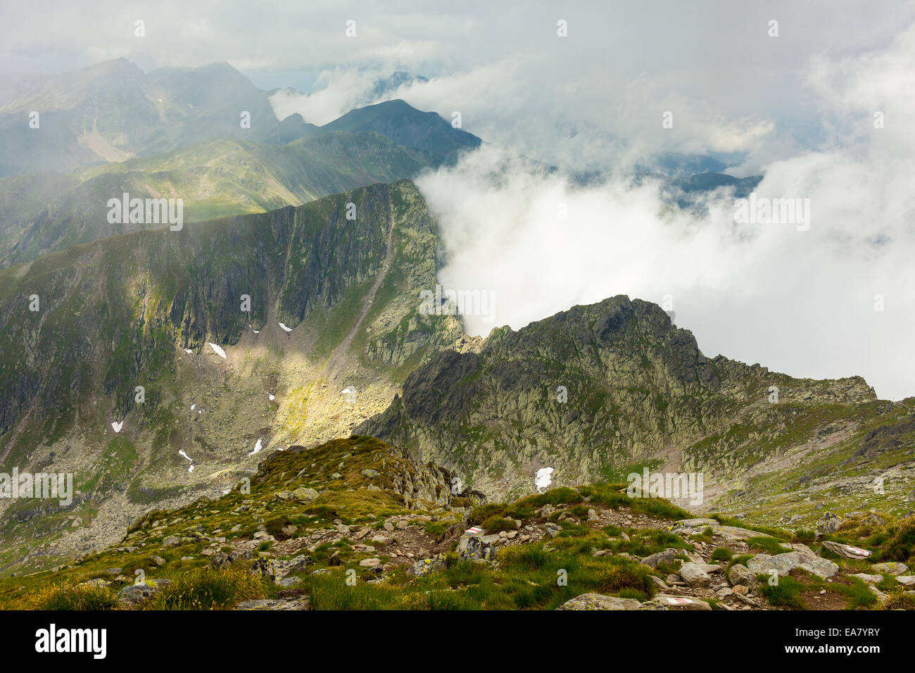Landscape with Fagaras mountains in Romania and clouds amongst them ...