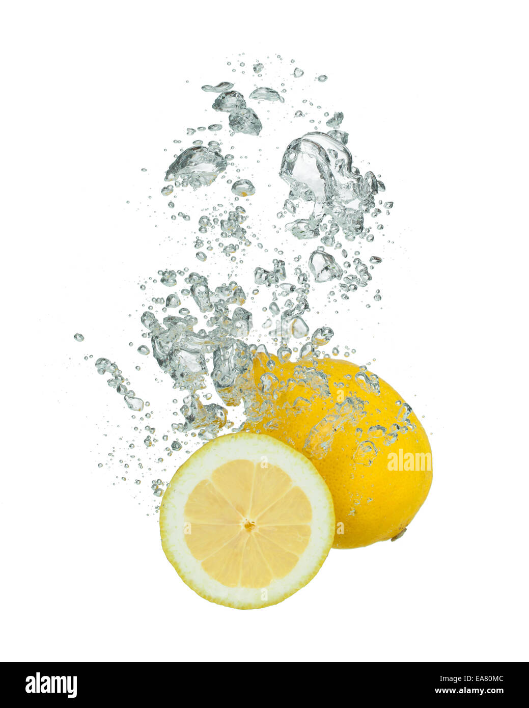 Isolated shot of lemon falling into water, isolated on white background ...