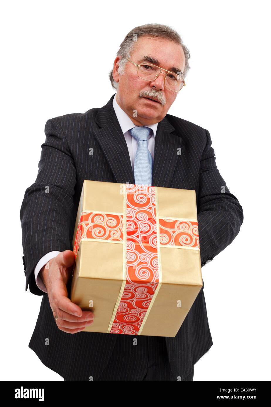 Serious senior business man offering big gift Stock Photo - Alamy