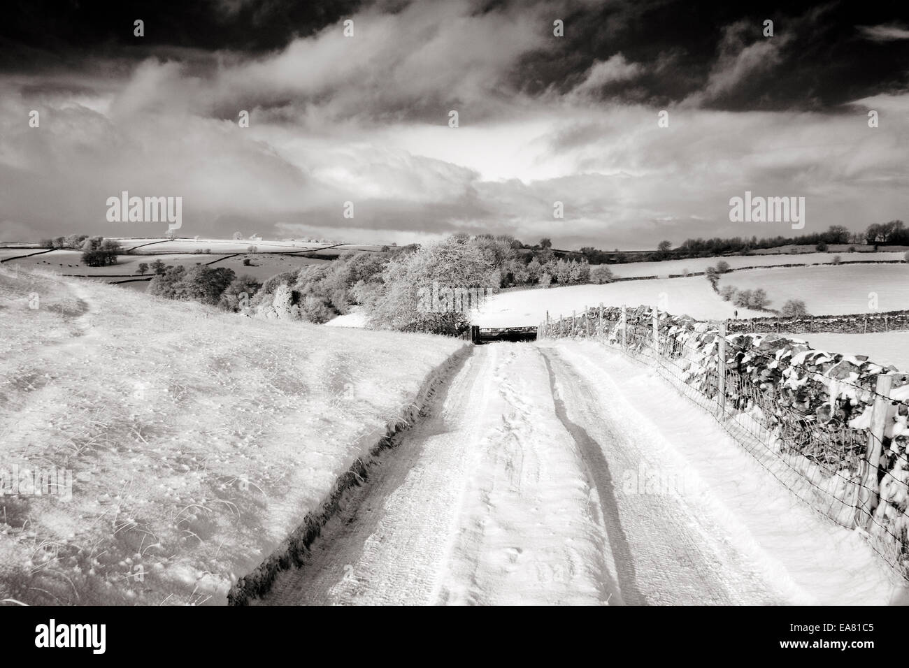 Country track with views across valley to distant hills near ...