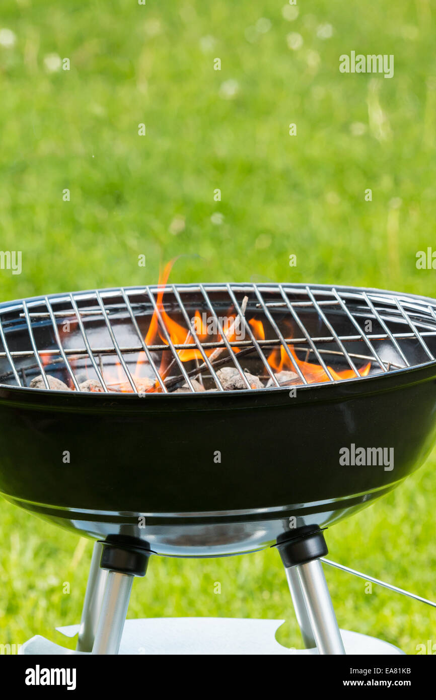 Empty grill on garden with burning embers Stock Photo - Alamy