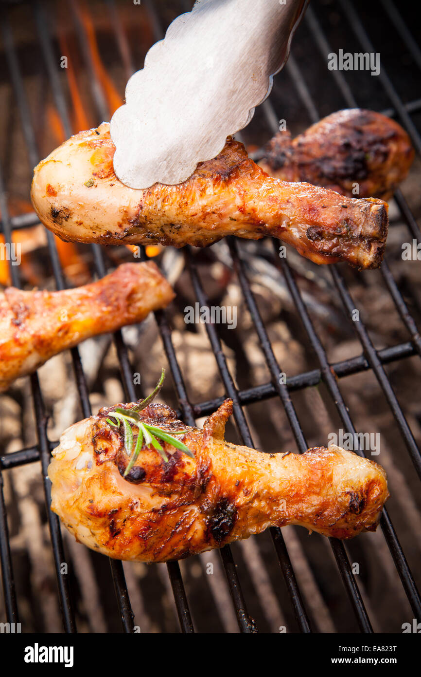 Grilled chicken legs on fire Stock Photo - Alamy