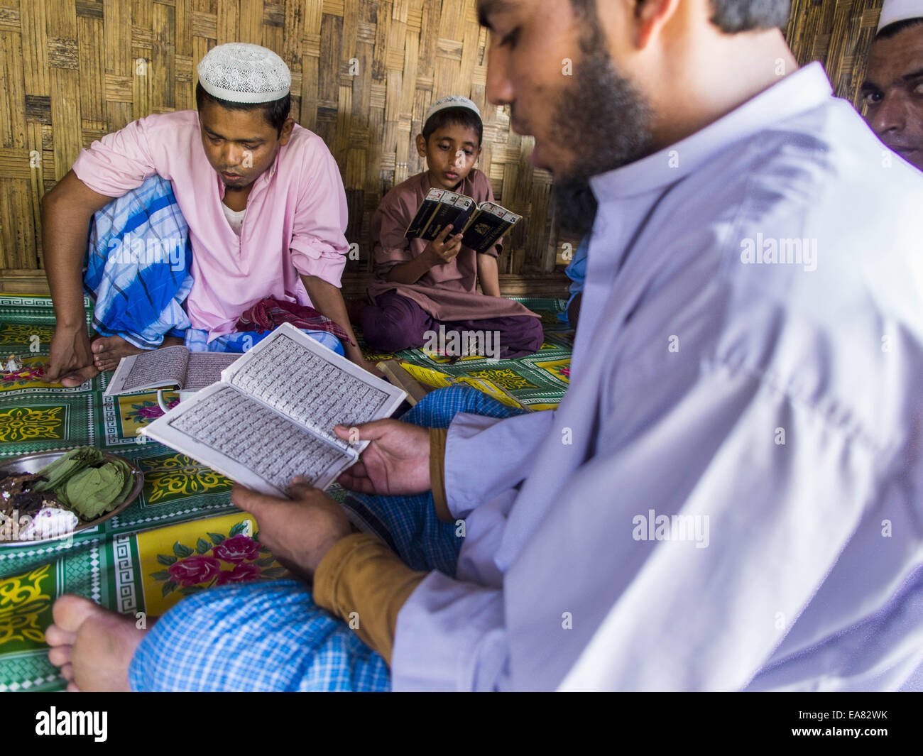 Sittwe, Rakhine, Myanmar. 6th Nov, 2014. Rohingya Muslim men study the ...