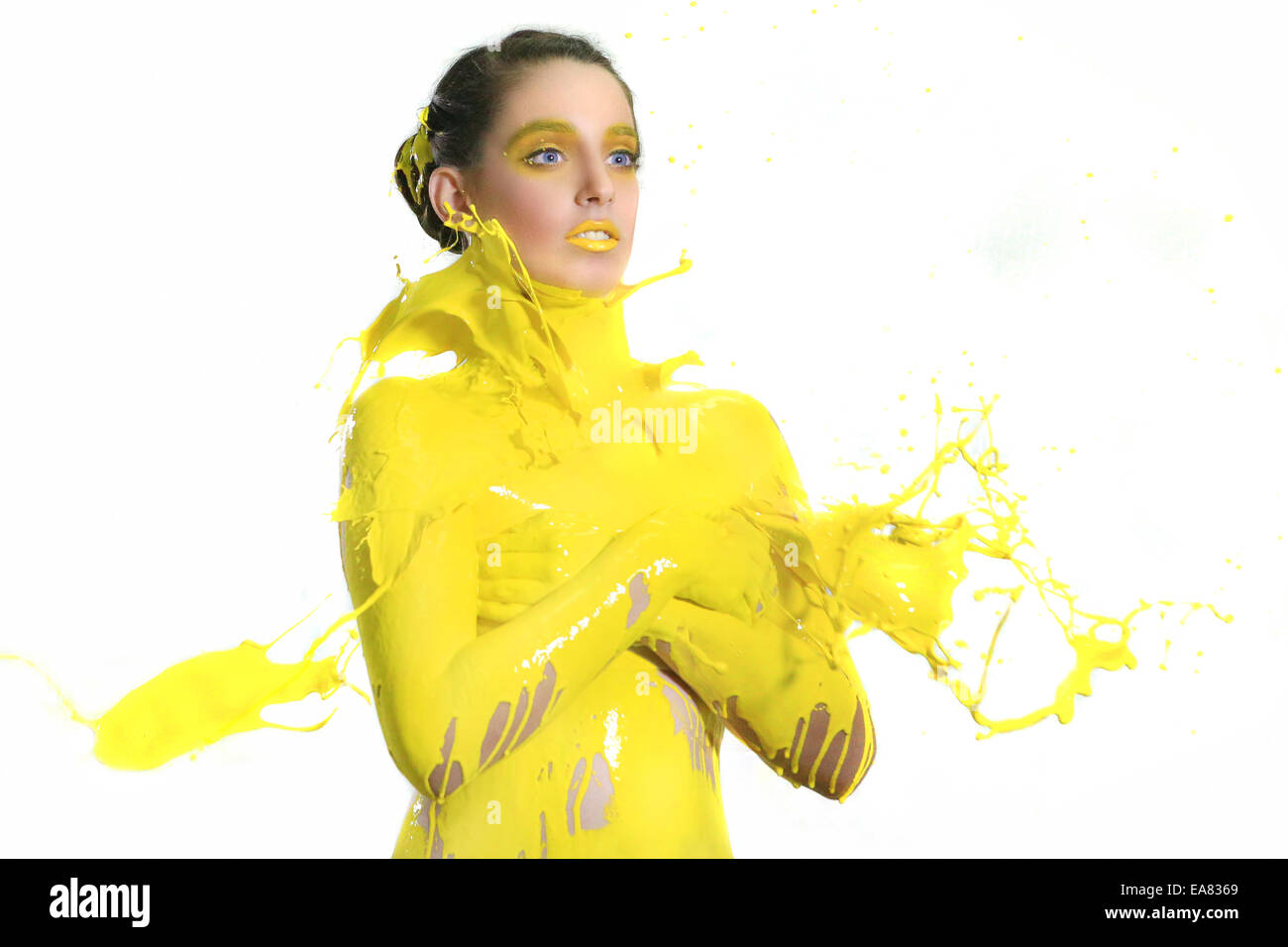 Beautiful Woman Covered in Bright Paint Splatter Stock Photo - Alamy