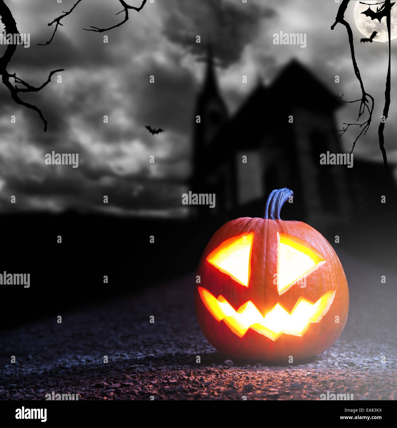 Burning evil halloween pumpkin with dark background Stock Photo - Alamy