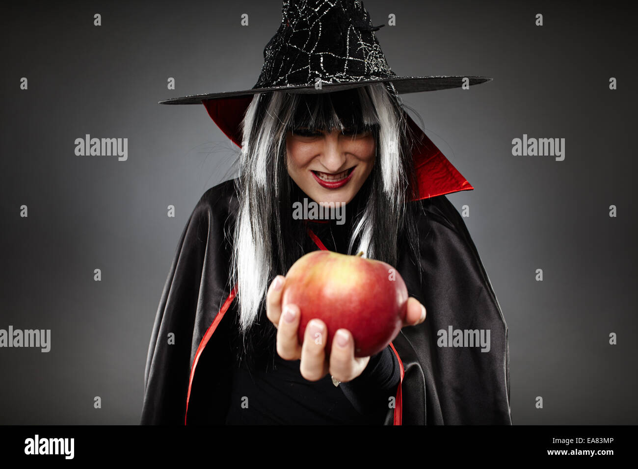 Witch with apple hi-res stock photography and images - Alamy