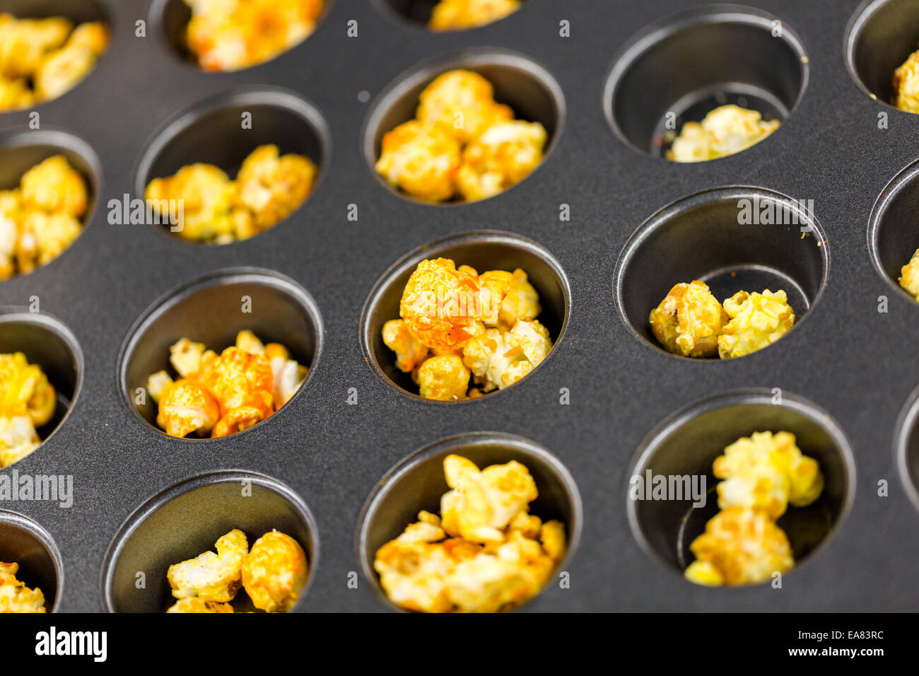 Flavored popcorn on the tray for sampling Stock Photo - Alamy