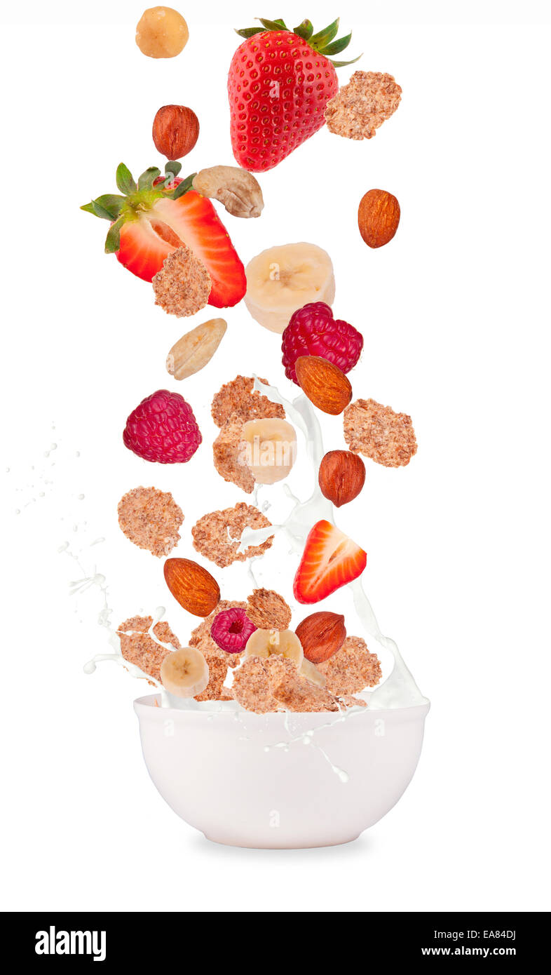 Healthy bowl with flying cereals and fruit, isolated on white ...