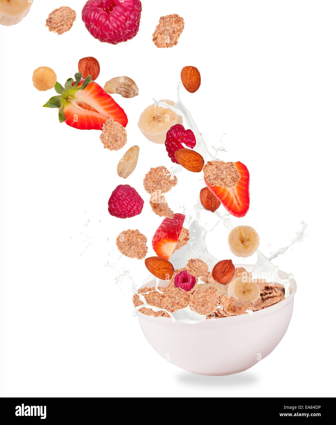 Healthy bowl with flying cereals and fruit, isolated on white ...