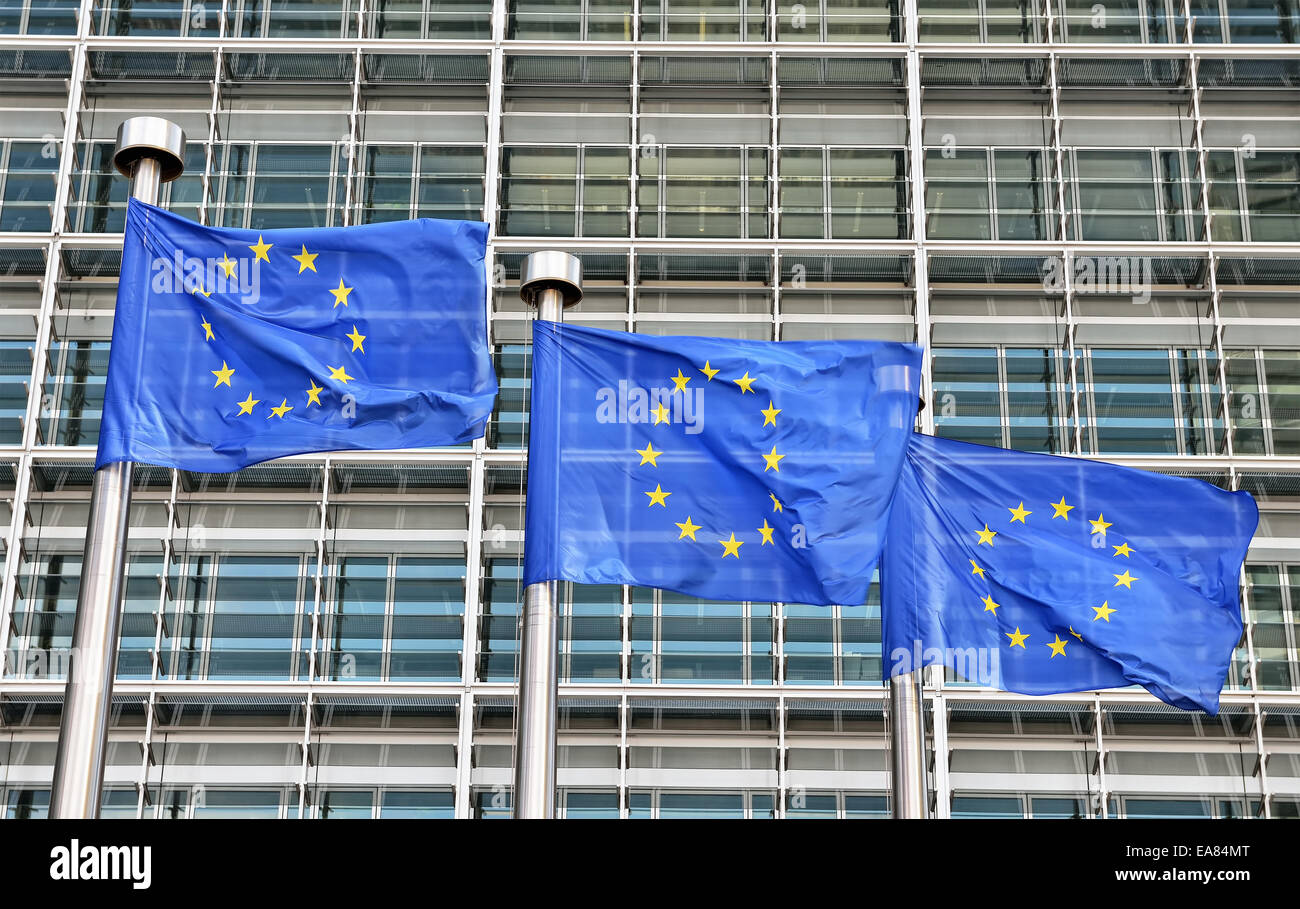 Blue flags of European Union at European Commission building Berlaymont ...